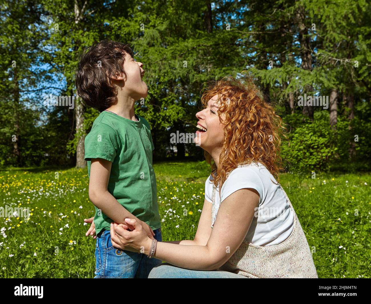 Red hair mother and her son have a playful conversation Stock Photo - Alamy