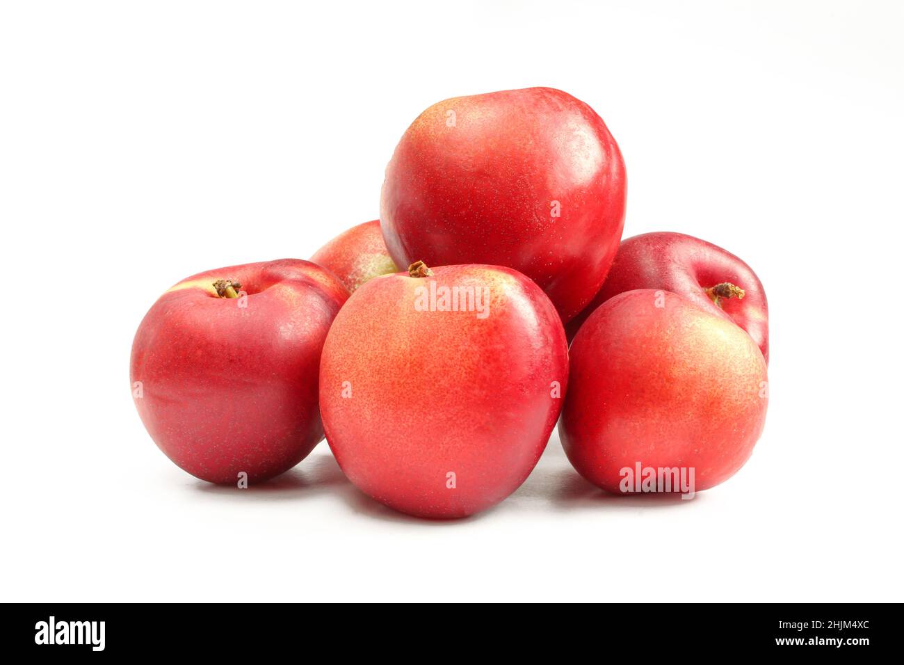 Group of smooth skin nectarines isolated on white background. Delicious ...