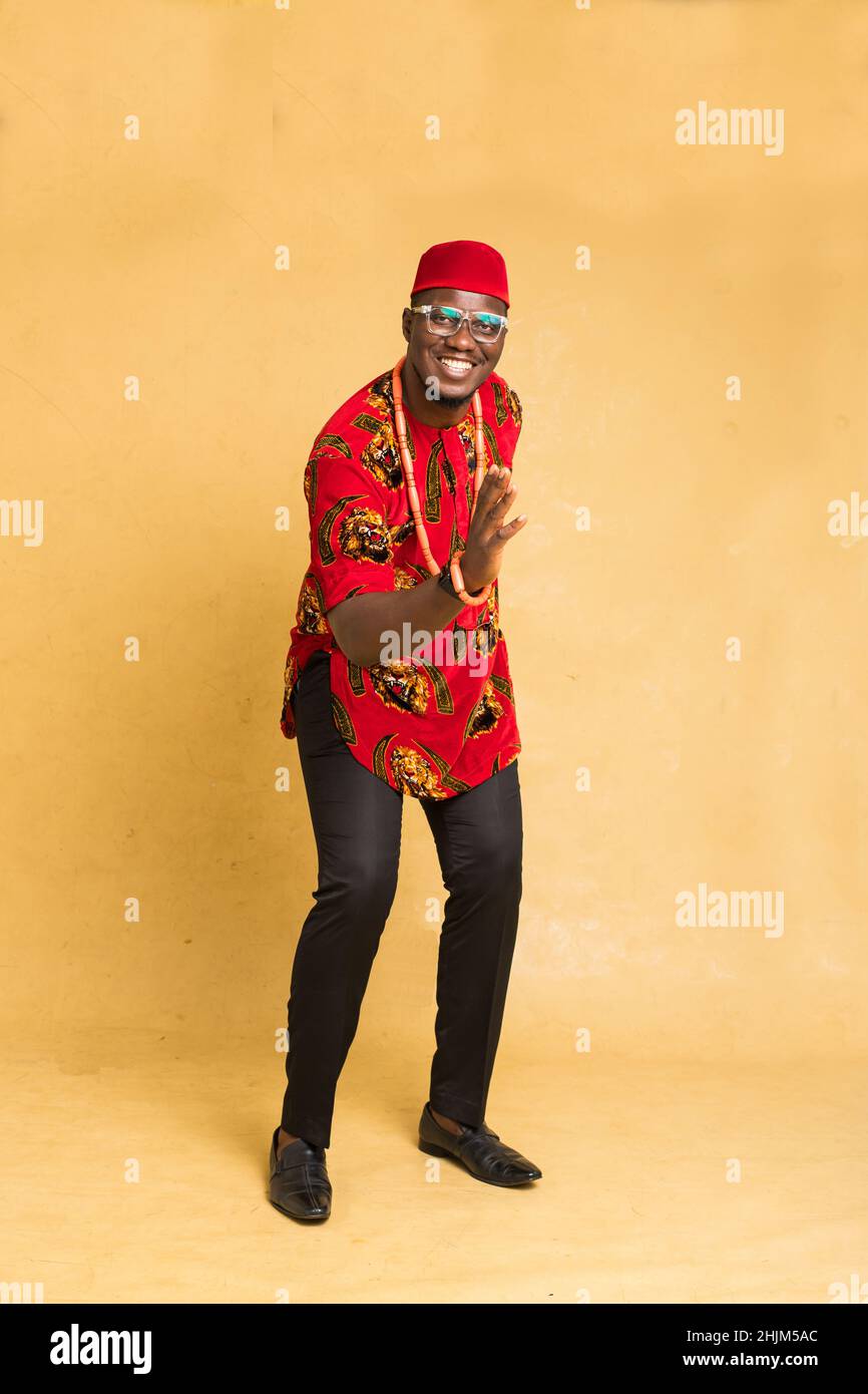 Igbo Traditionally Dressed Business Man Standing Dancing with Hand ...