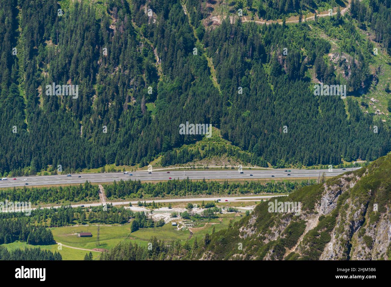 The highway between the alps seen from above. The mountains are covered ...