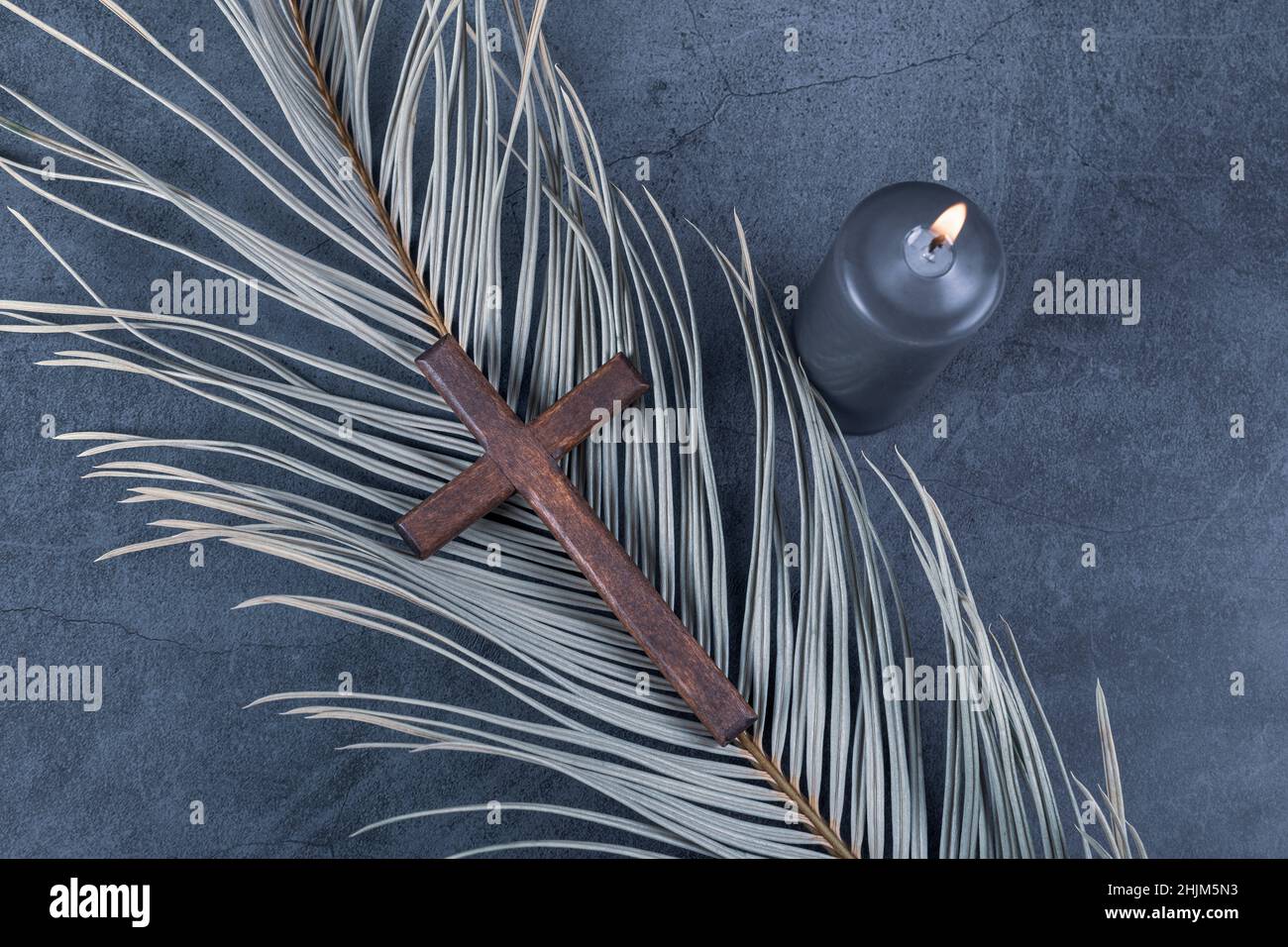 Catholic Cross with palm leaf and burning candle. Ash Wednesday, Lent ...