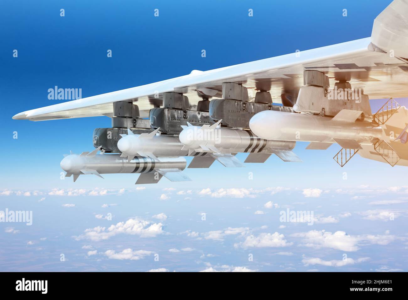 Fighter jet plane wing with full combat stocks on the wing in the sky ...