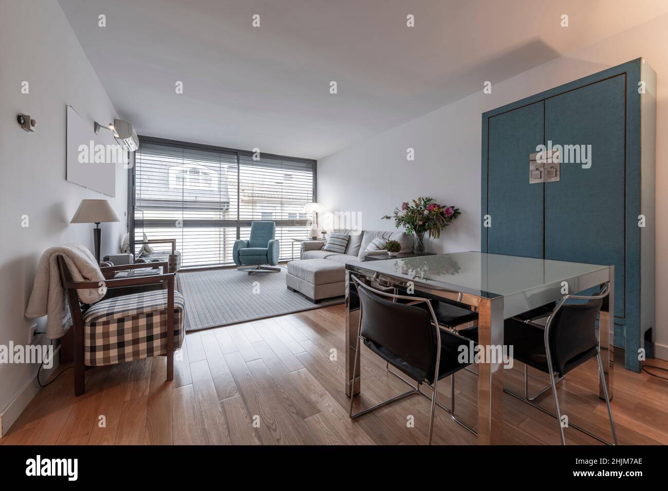 Dining room with austere contemporary decoration and touches of bondi ...