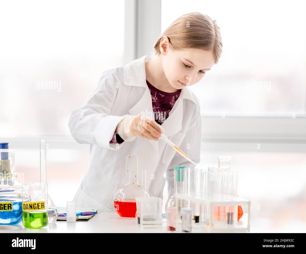 Girl on chemistry lesson Stock Photo - Alamy
