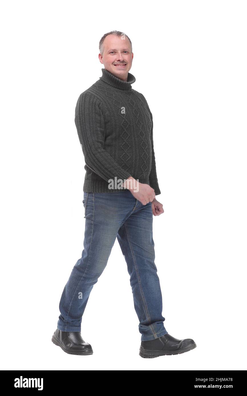 Side view of a casual man walking forward and smiling Stock Photo - Alamy