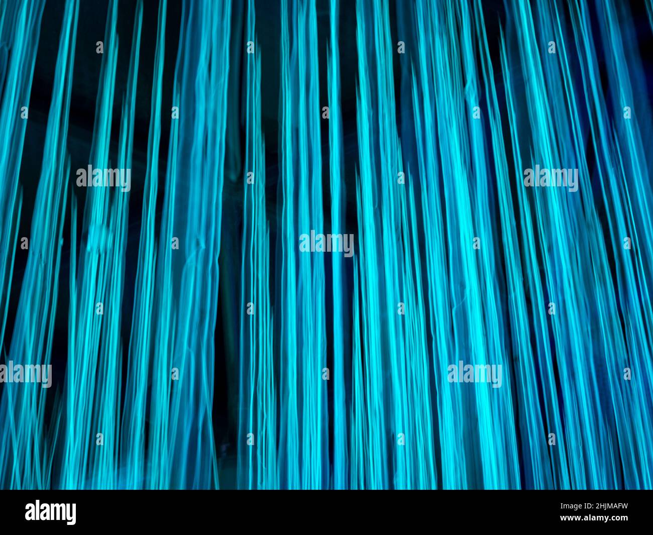 Cyan Vertical Lines on a Black Background Stock Photo - Alamy
