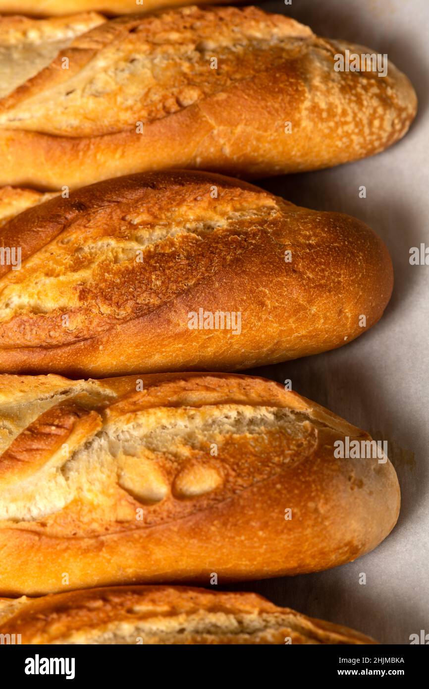 A closeup background of smaller French bread baguettes Stock Photo - Alamy