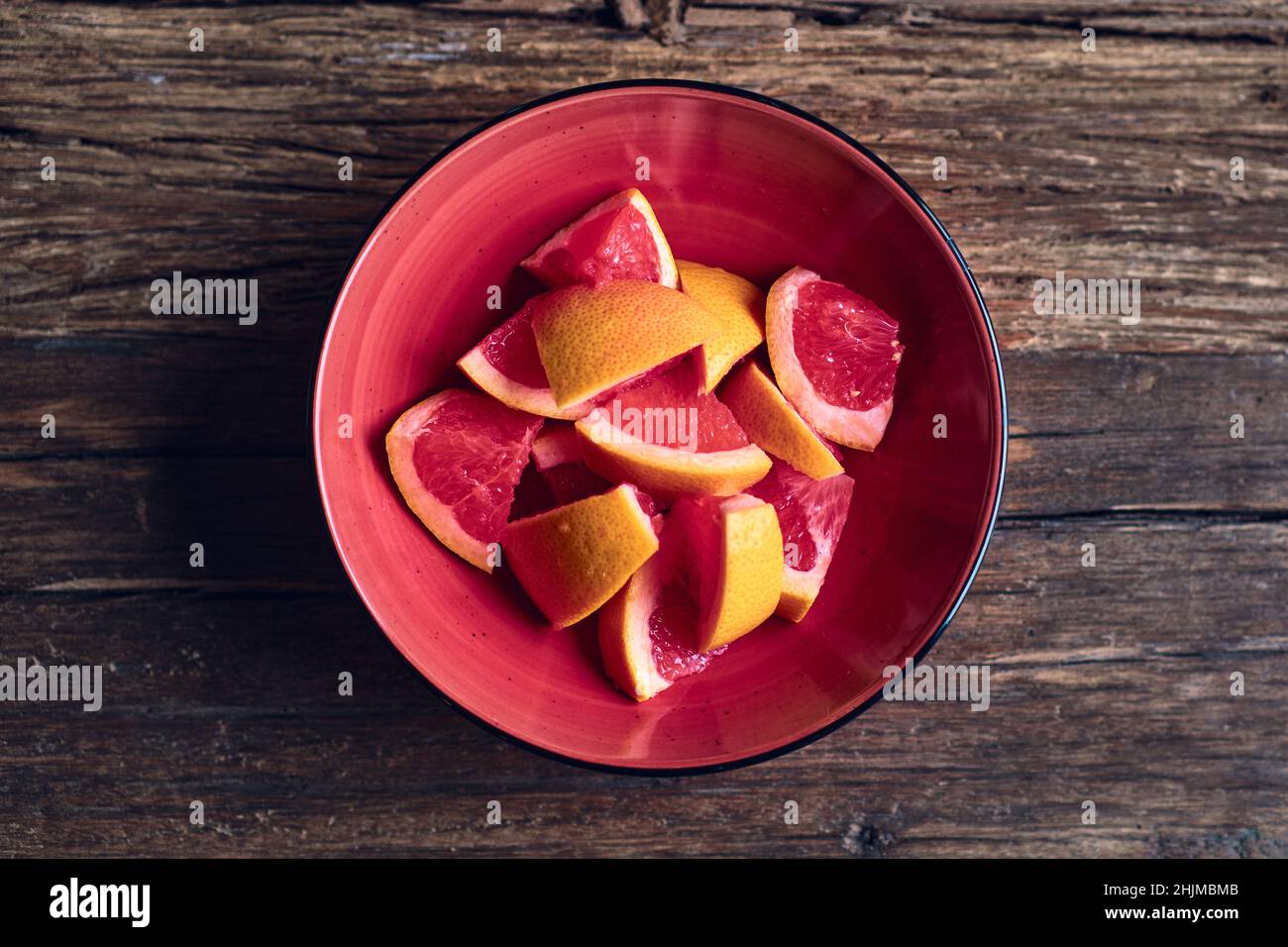 Grapefruit pieces in a red bowl. High quality photo Stock Photo - Alamy