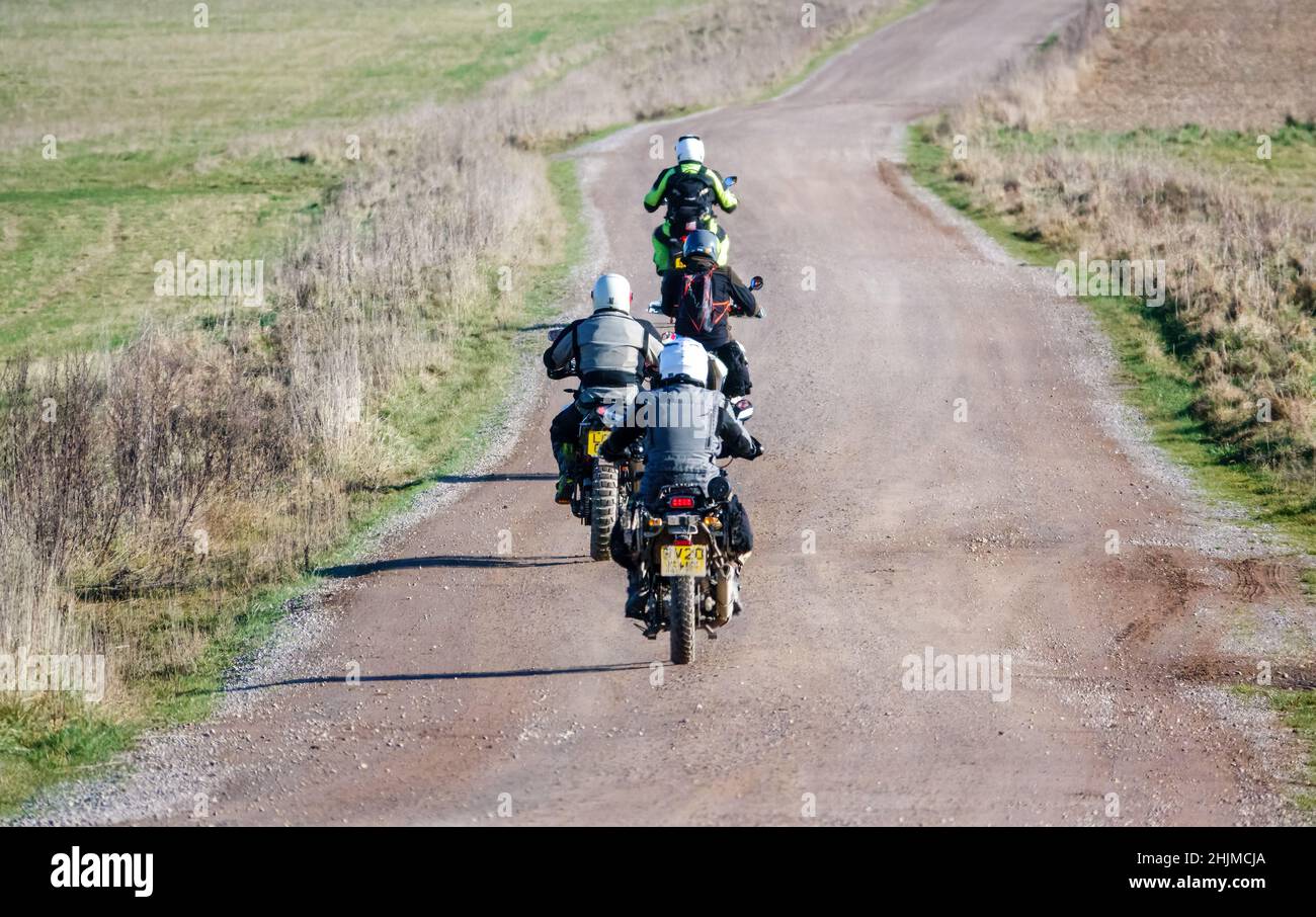 a group of motor cyclists (bikers) riding their off-road motorbikes ...