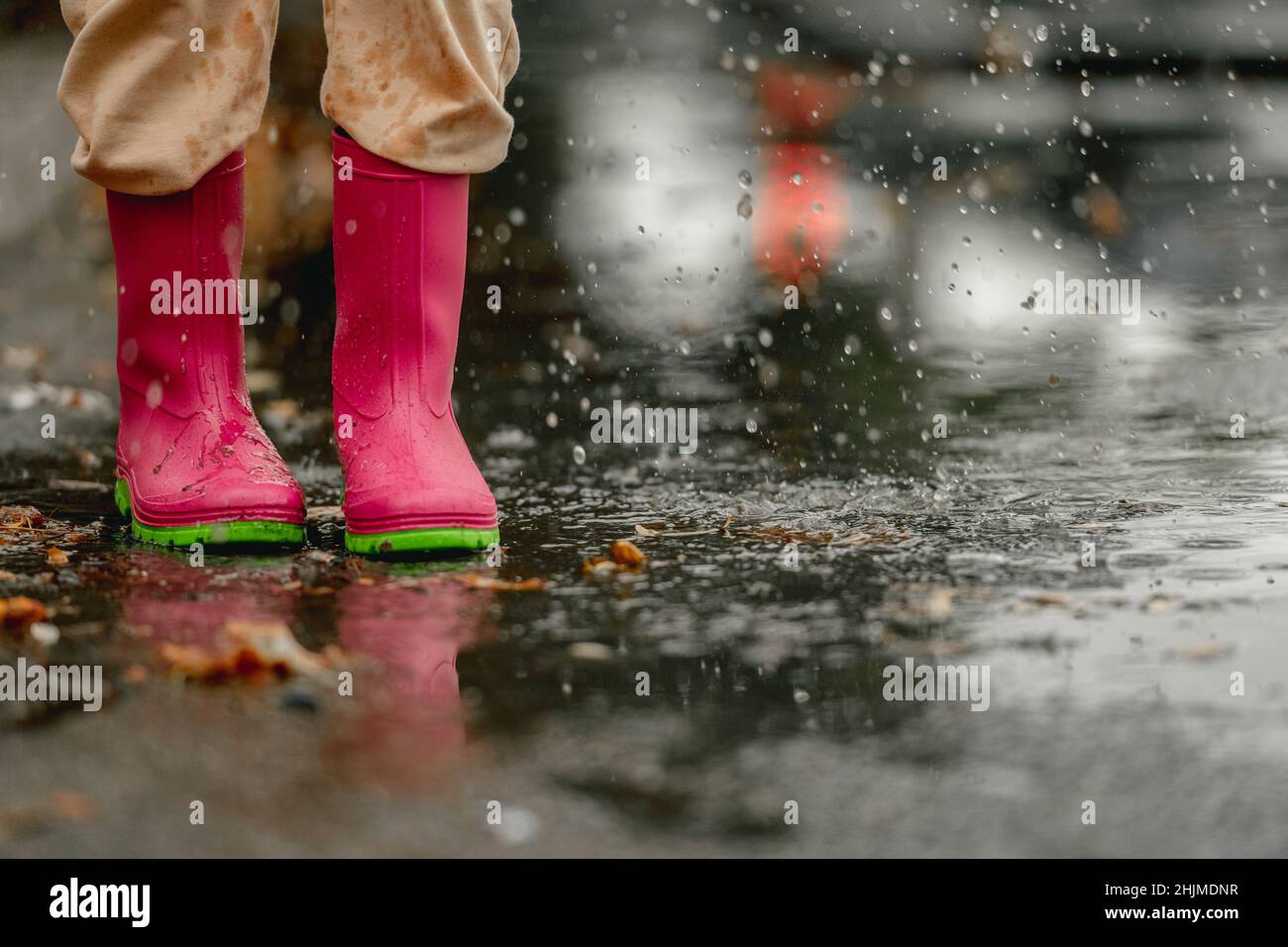 Child in rubber boots Stock Photo - Alamy