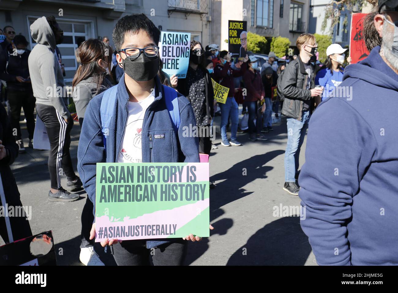 A protester holds a placard during the Asian Justice Rally.Some Asian ...