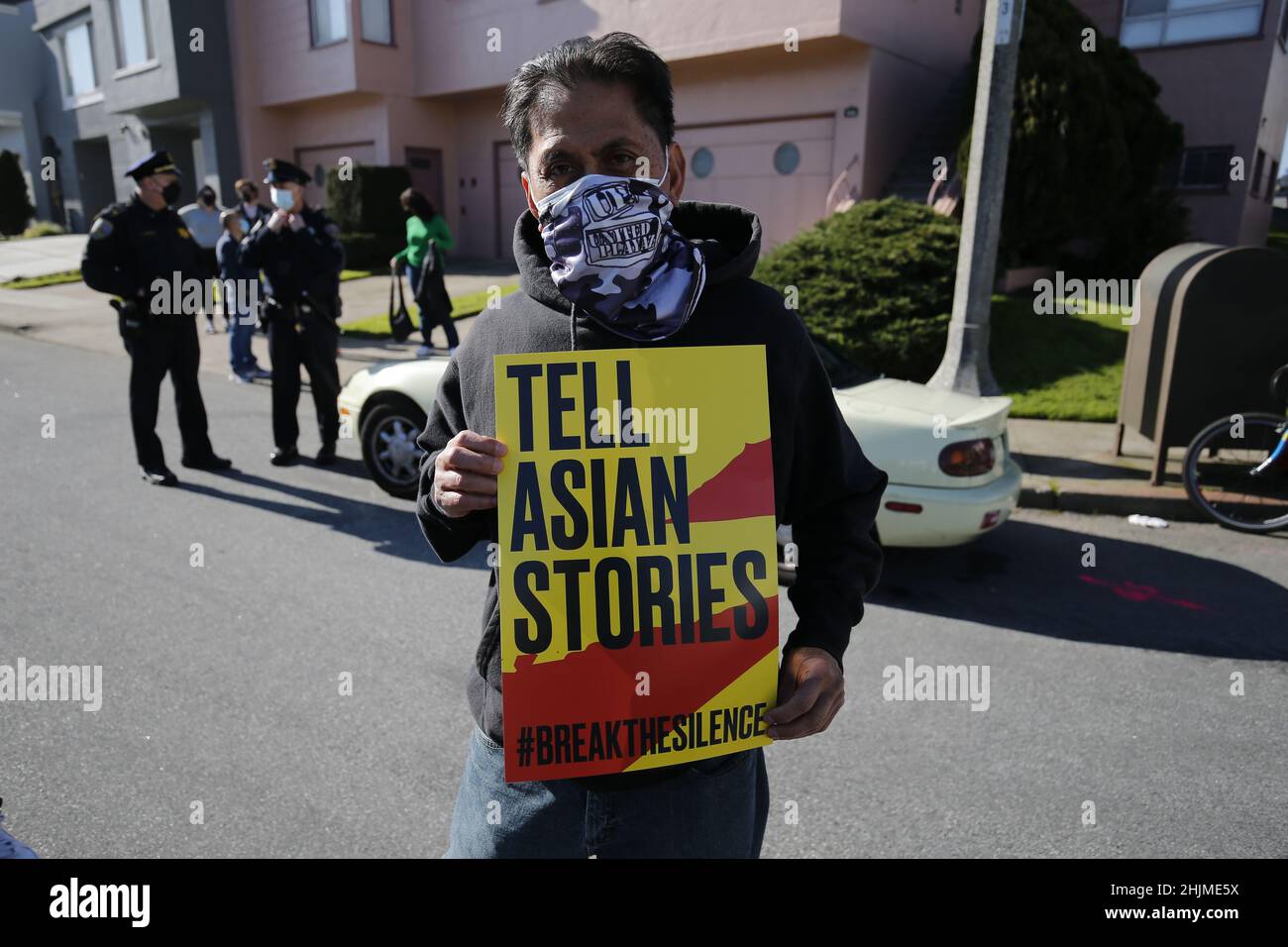 A protester holds a placard during the Asian Justice Rally.Some Asian ...