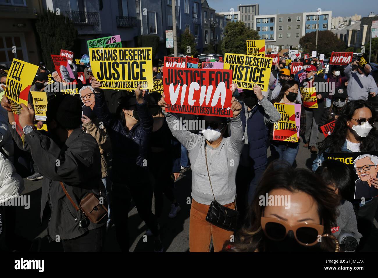 Protesters hold placards during the Asian Justice Rally.Some Asian ...