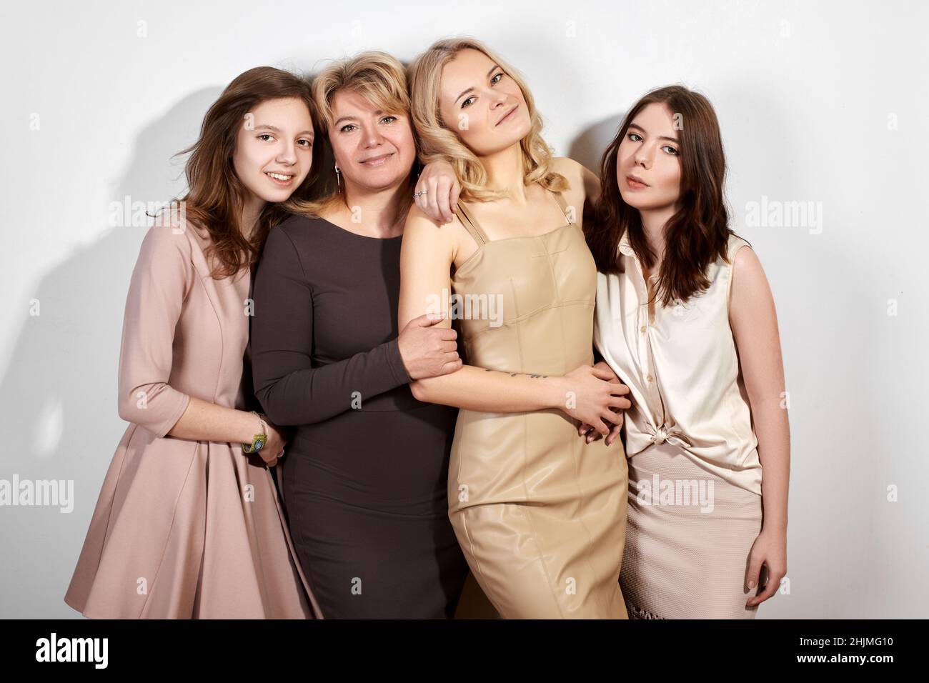Happy Family of Mother with Three Daughters on Light Grey Background ...