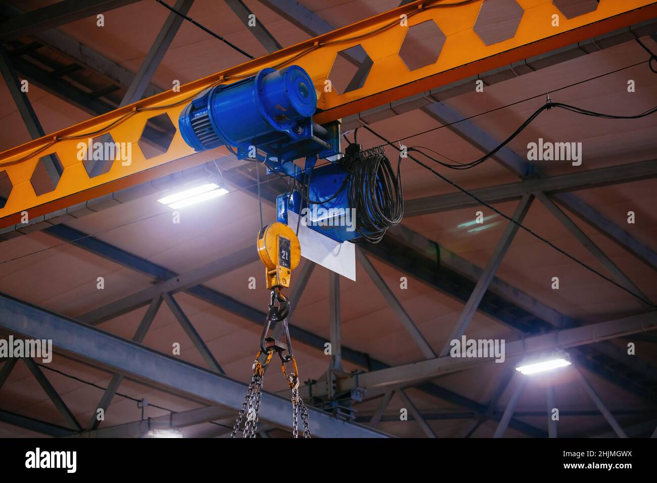 Overhead crane in the industrial building, close up Stock Photo - Alamy