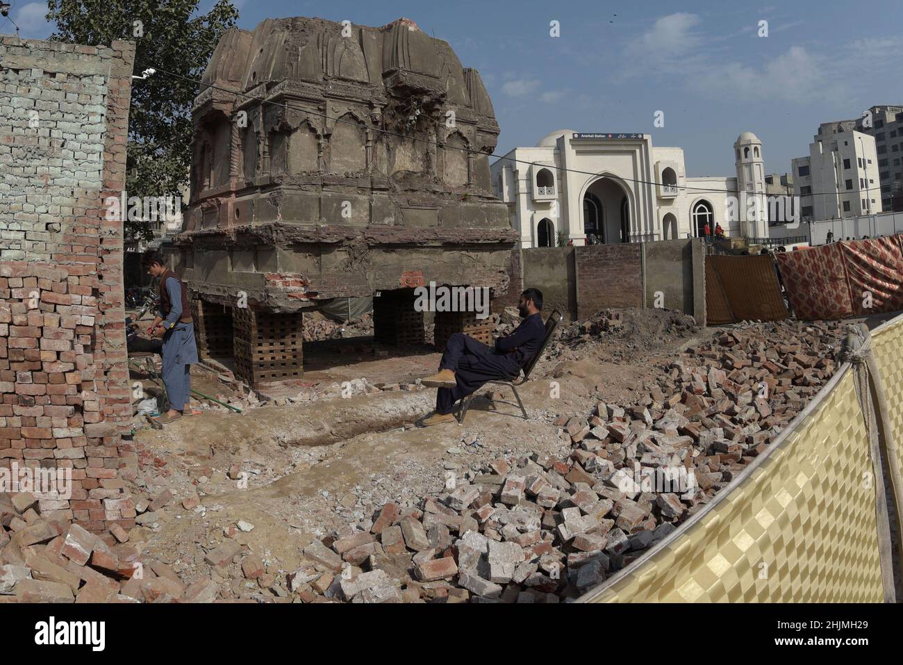 Pakistani laborers busy in the reconstruction of Jain Mandir temple ...