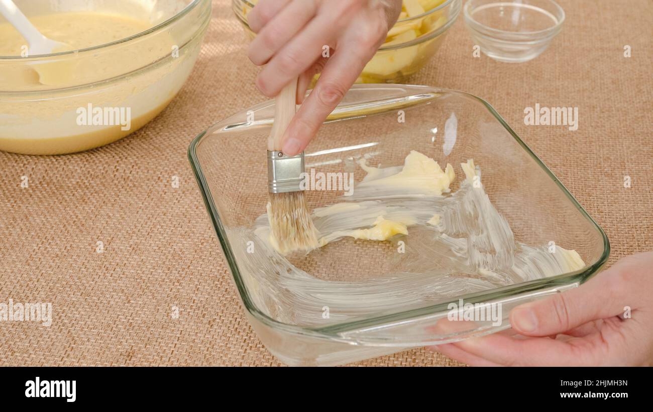 Woman spreads butter on baking hi-res stock photography and images - Alamy