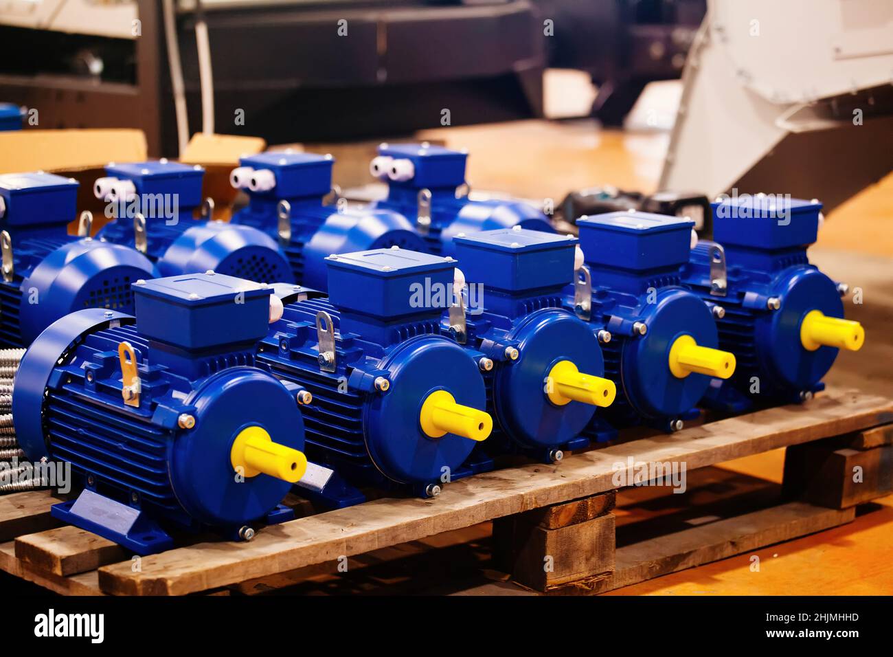 New blue electric motors in the factory for assembling Stock Photo - Alamy