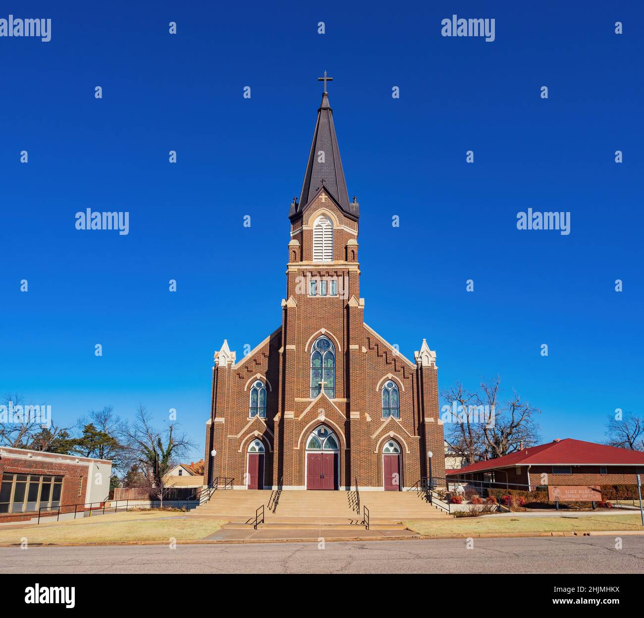 Sunny exterior view of the St Mary Catholic Church at Guthrie, Oklahoma ...