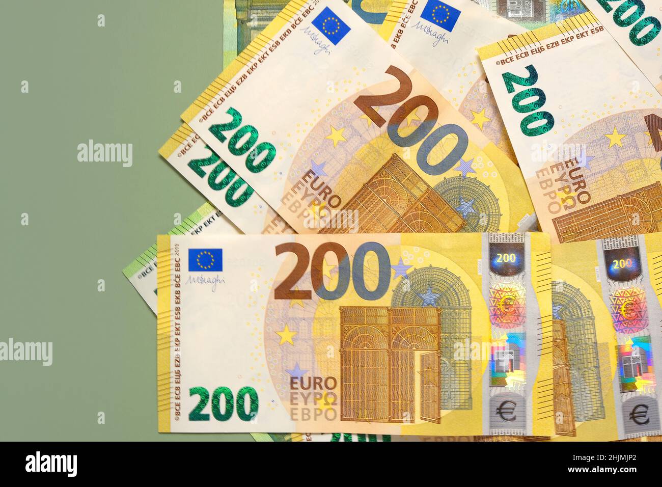 Money background.Euro banknotes. two hundred euro banknotes on a green ...