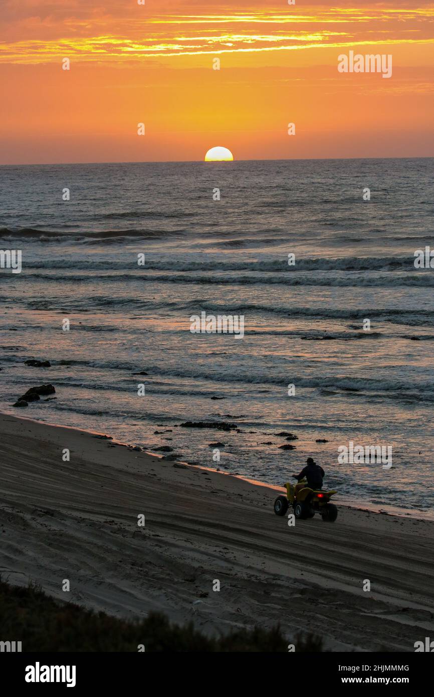 Quad Bik on the beach at sunset, Namibia Stock Photo - Alamy