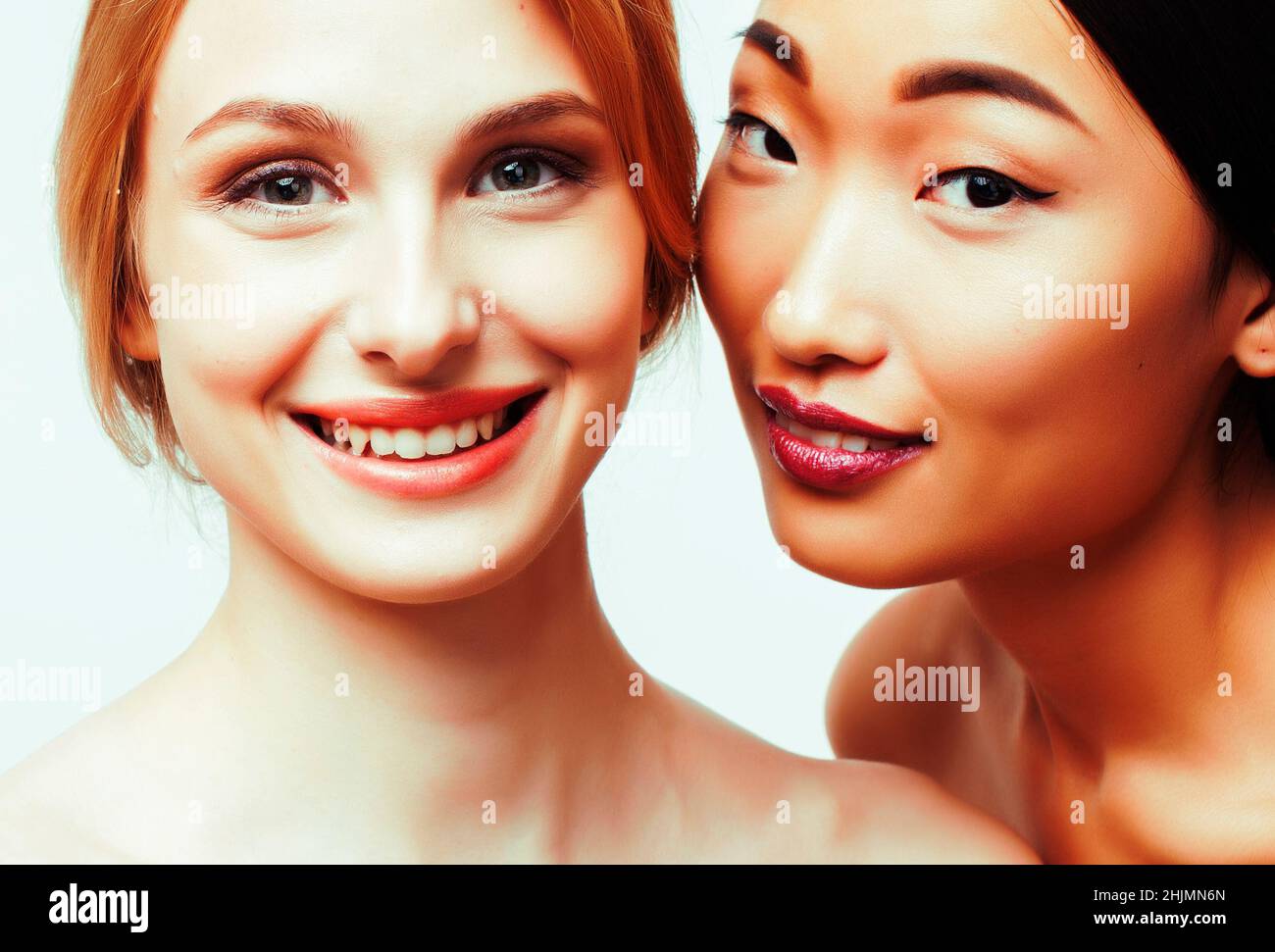 different nation woman: caucasian and asian together isolated on white ...