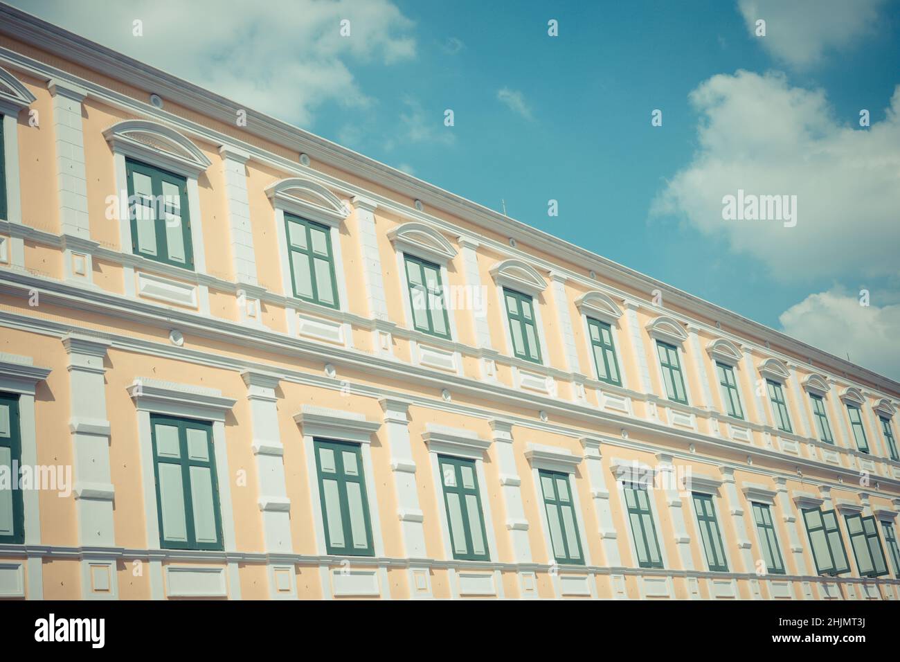 abstract row of the orange colored building with blue sky background ...