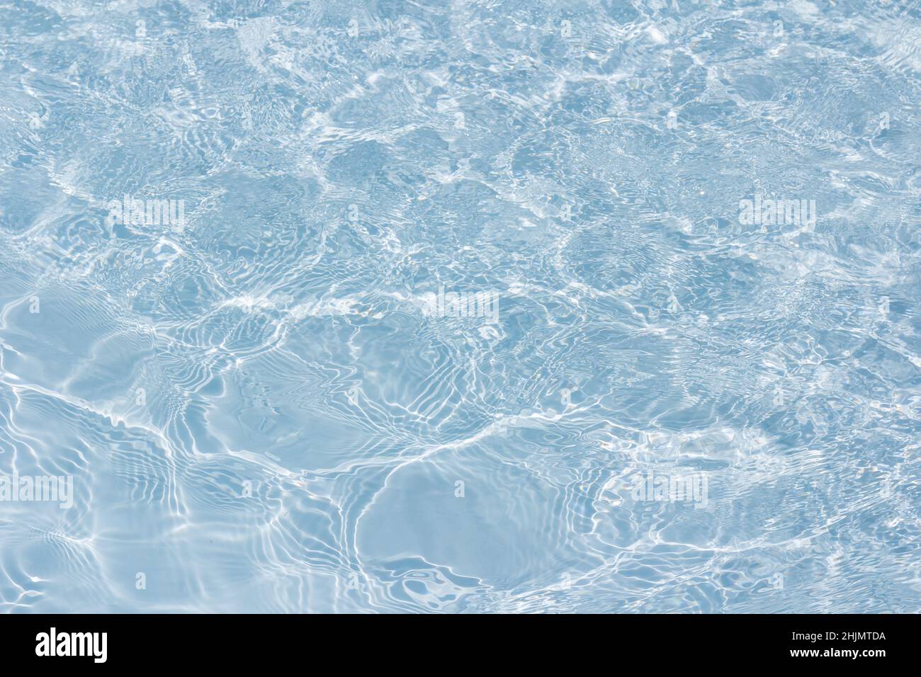 swimming pool with sunny reflections background Stock Photo - Alamy