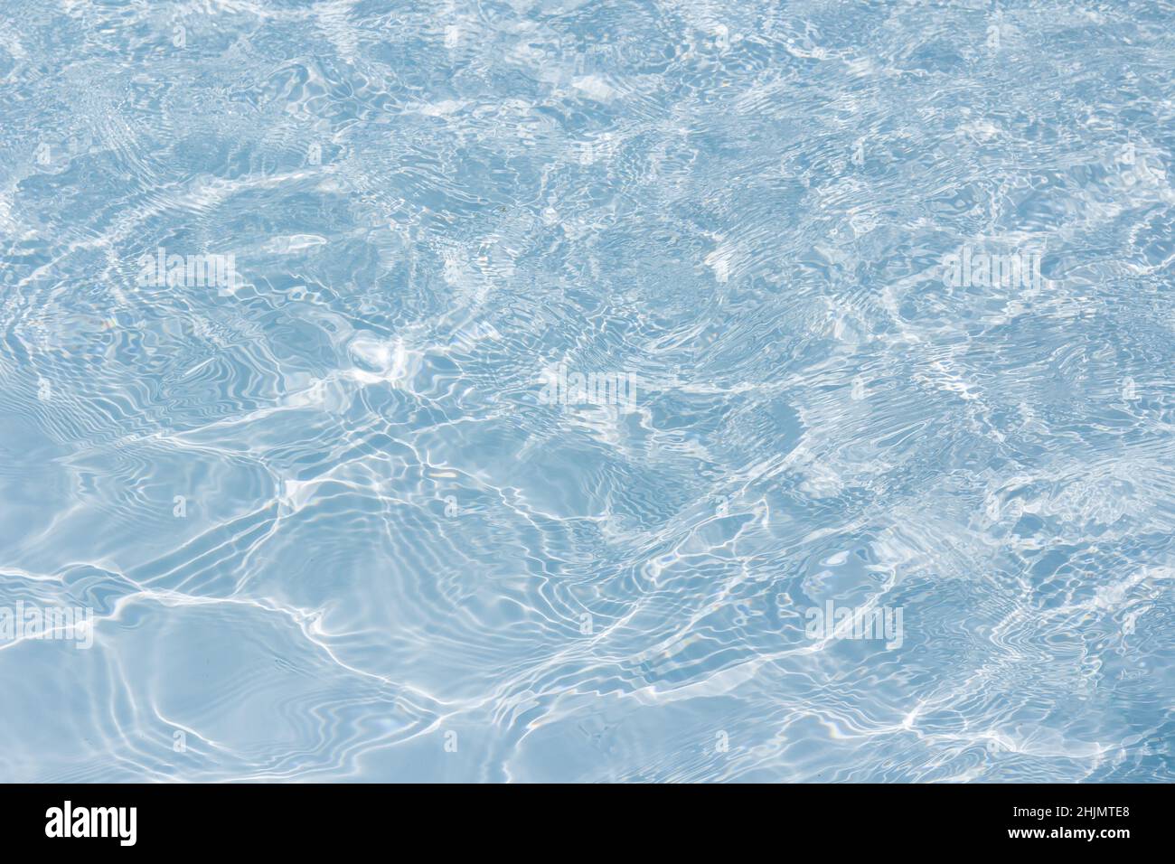 swimming pool with sunny reflections background Stock Photo - Alamy