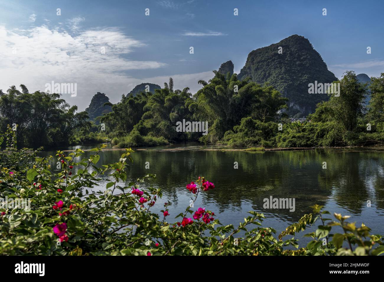 Li River surrounded by flowers and trees at Yangshuo, Guangxi Province ...