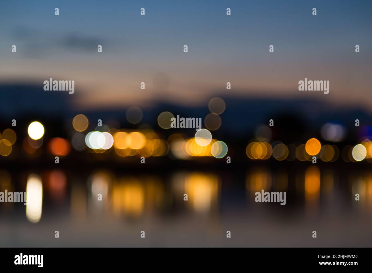 Multi color lights bokeh with reflection background Stock Photo - Alamy