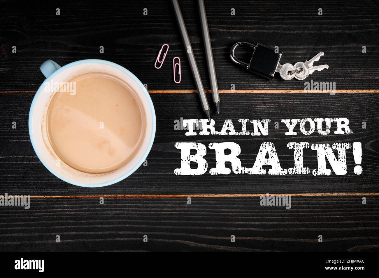 Train Your Brain. Text on a wooden texture background Stock Photo - Alamy