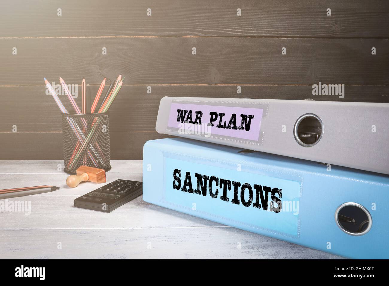War Plan and Sanctions. Policy, law and influence concept. Two document ...