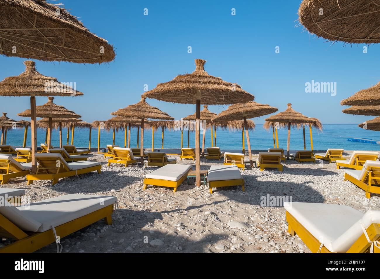Straw umbrellas and sunbeds hi-res stock photography and images - Alamy
