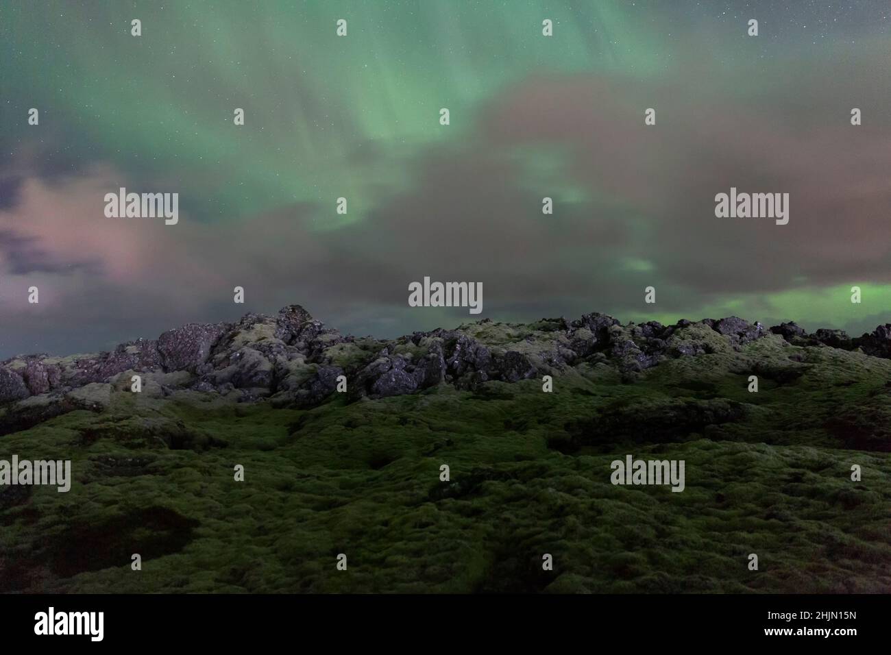Aurora Borealis above ancient lava fields in Iceland beside Thorbjorn ...