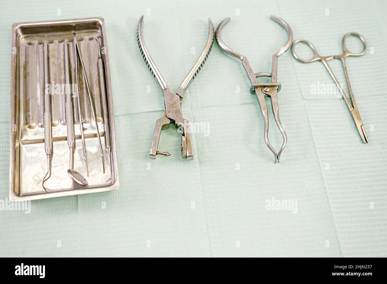 Close up of dental equipment from metal lying on the table in the ...