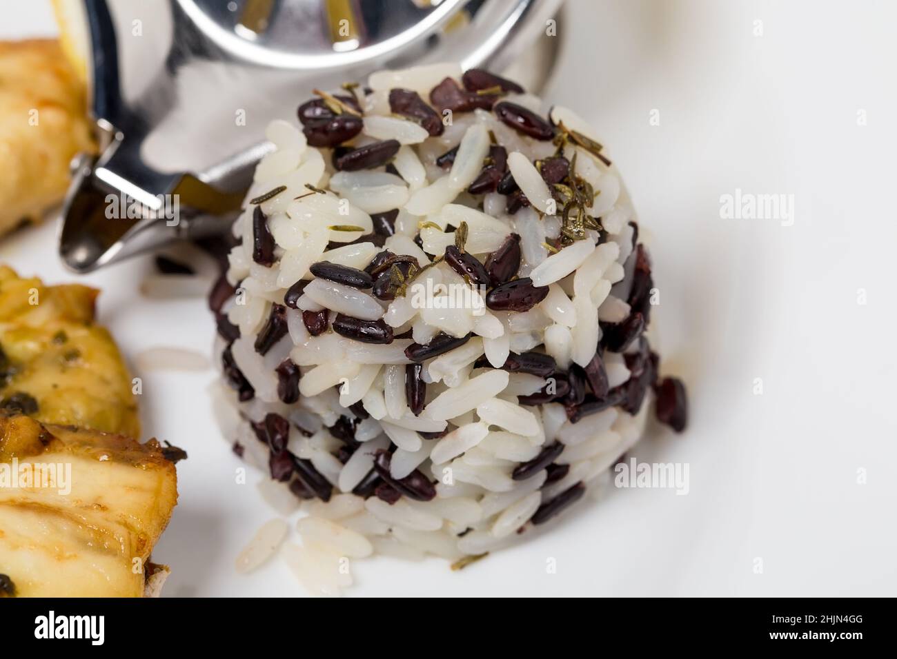 Closeup of delicious roasted fish fillets with rice. Can be used as a ...