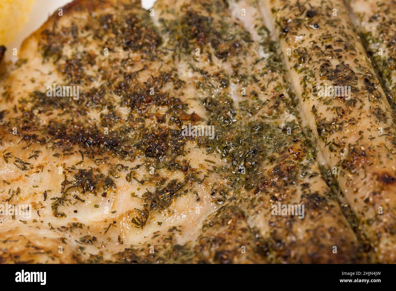Roasted fish fillet with herbs. Can be used as a whole background Stock ...