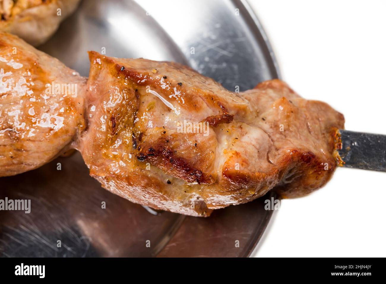 Grilled pork shish kebab with garnish. Macro. Can be used as a whole ...