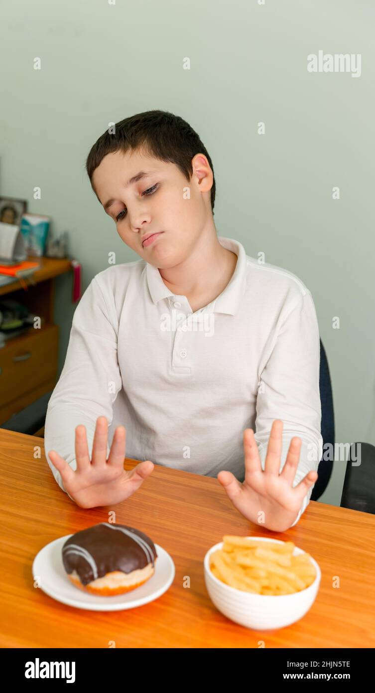 Child refuses to eat unhealthy fast food. Healthy eating Stock Photo ...
