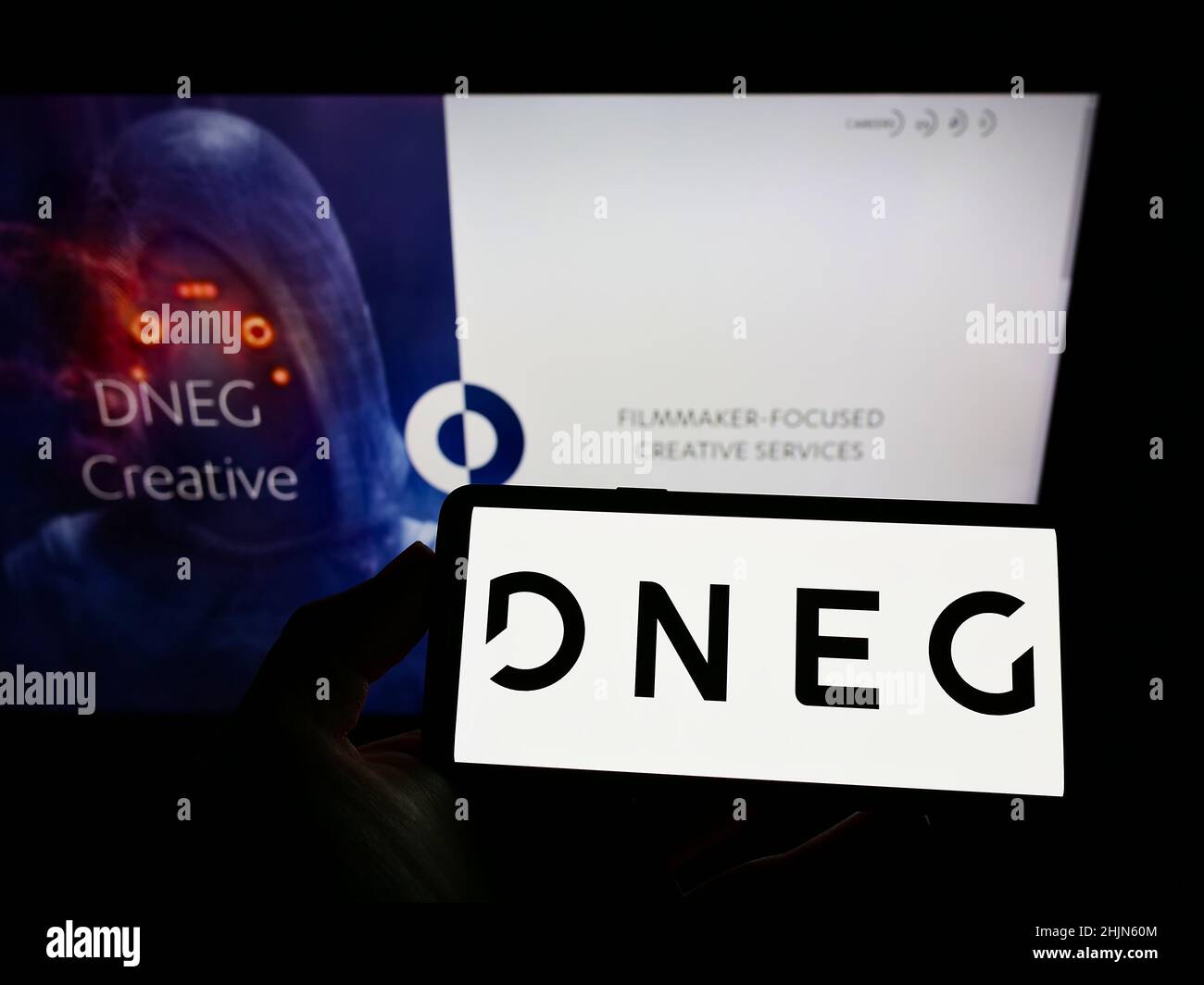 Person holding cellphone with logo of British visual effects company ...