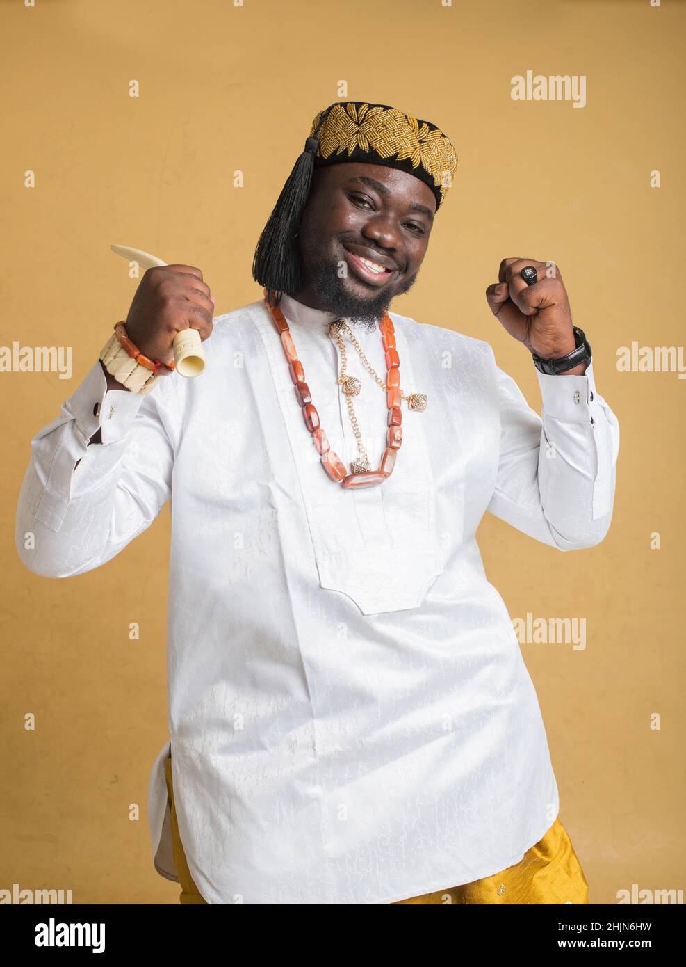 Ibibo Calabar Akwa Ibom Culturally Dressed Man full with both fists up ...