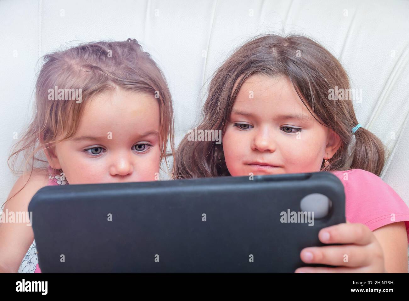 Child watching a tablet hi-res stock photography and images - Alamy