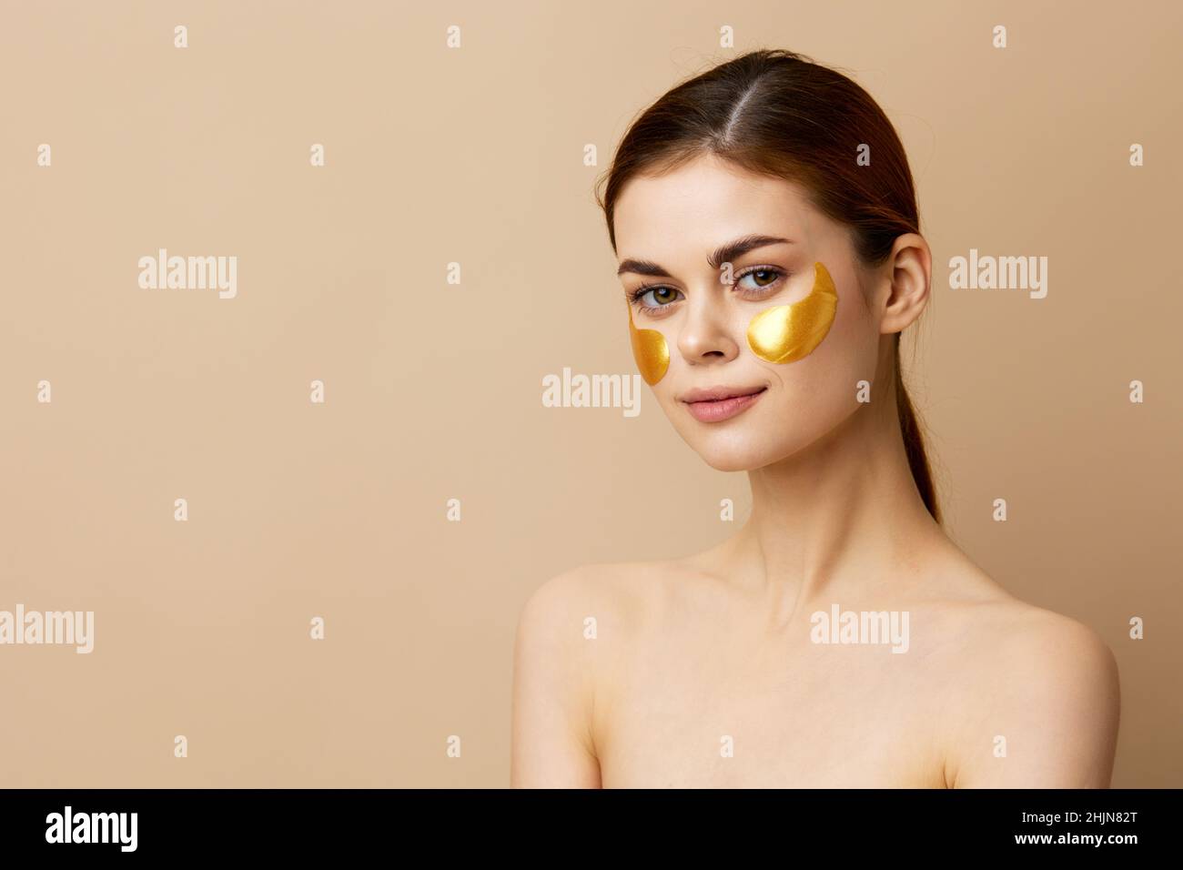 woman patches rejuvenation skin care fun after shower close-up ...