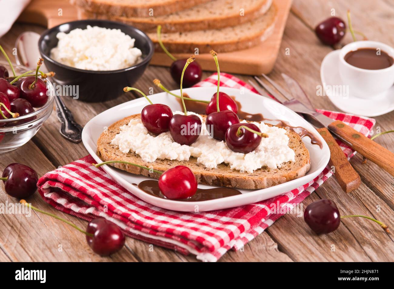 Rye bread with cottage cheese and cherries Stock Photo - Alamy