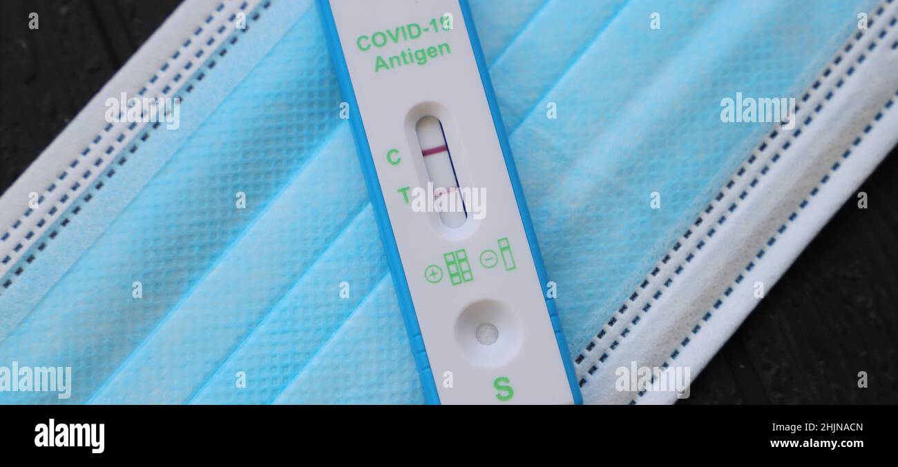 a positive corona antigen test on a mask Stock Photo - Alamy