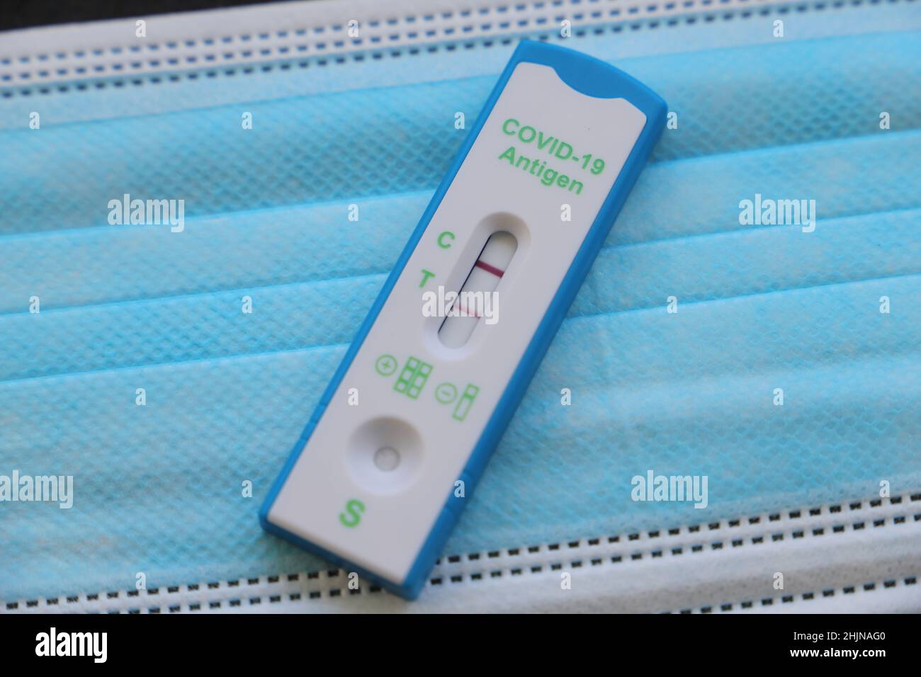 a positive corona antigen test on a mask Stock Photo - Alamy