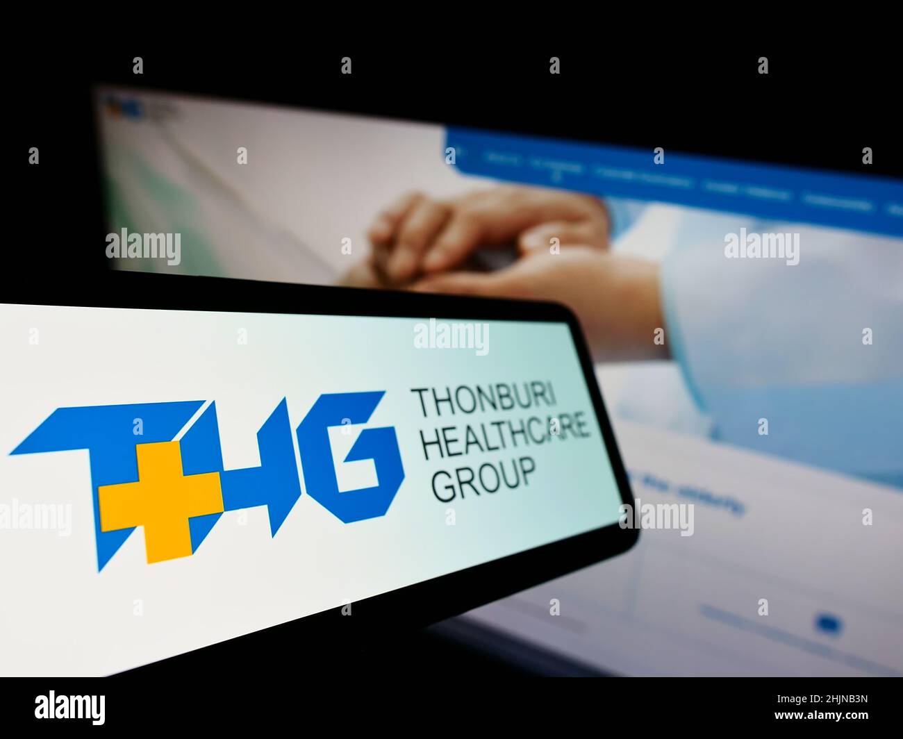 Smartphone with logo of Thai company Thonburi Healthcare Group (THG) on ...
