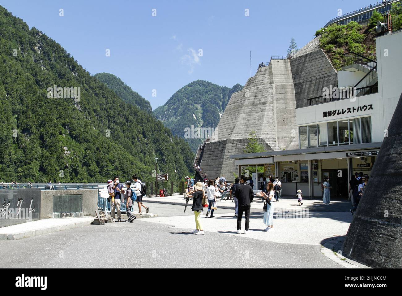Nagano, Japan, 2021-23-07 , people preparing to cross the Kurobe dam in ...
