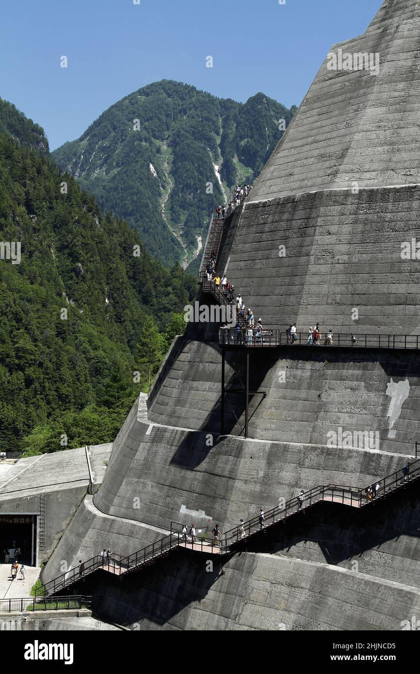 Nagano, Japan, 2021-23-07 , people climbing the cement wall to reach a ...